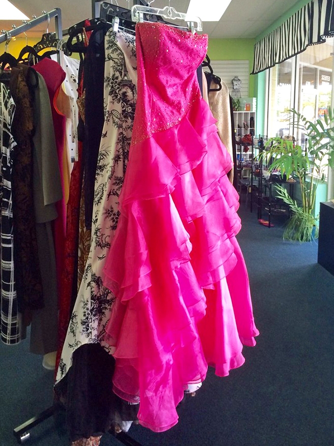 Formal gowns waiting for their next big night out. That hot pink number could turn any retirement community dance into Studio 54.