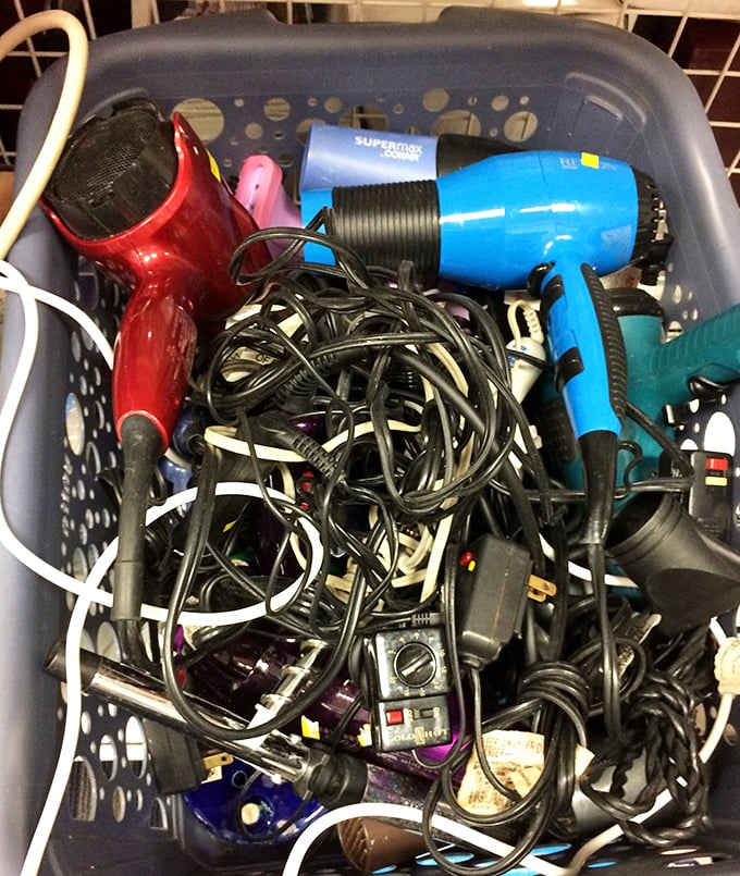 The electronics basket might look chaotic, but hidden among those cords could be a perfectly good hair dryer or coffee maker.