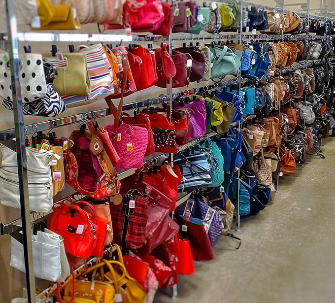 Handbag heaven organized by color—from cherry red clutches to turquoise totes, arm candy for every occasion.