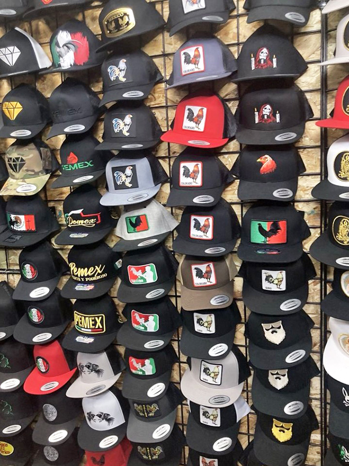 Hat wall that would make any baseball cap collector weep with joy. The rooster designs are particularly popular &ndash; something to crow about!