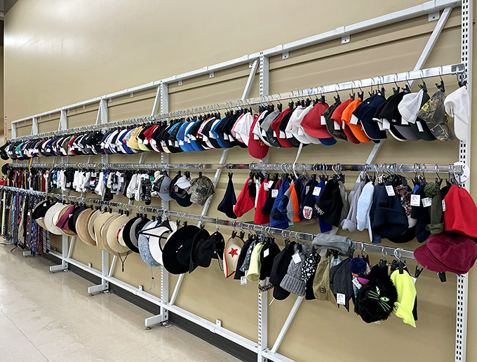 The hat wall&mdash;a headwear buffet where baseball caps from forgotten promotions hang alongside sun hats that have never seen a beach day.