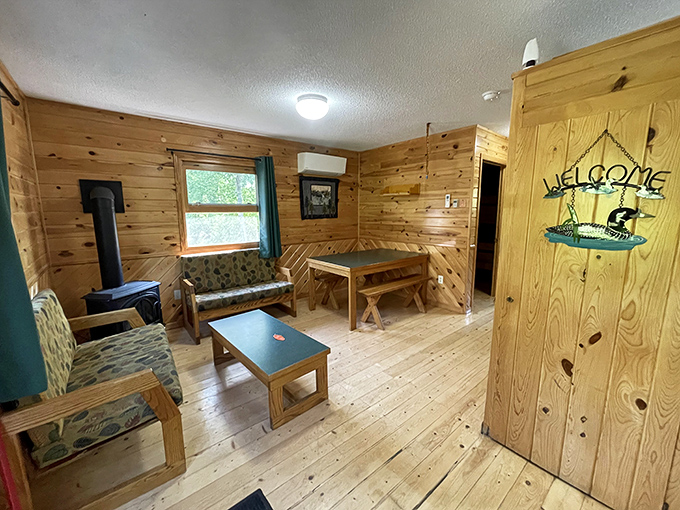 Knotty pine paradise where board games replace boardrooms. That wood-paneled welcome feels like a warm hug from a lumberjack grandpa.
