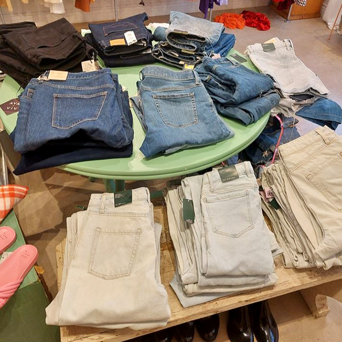 Denim democracy on display&mdash;jeans of every shade and size neatly folded and categorized. Your next favorite pair is hiding somewhere in this blue sea.