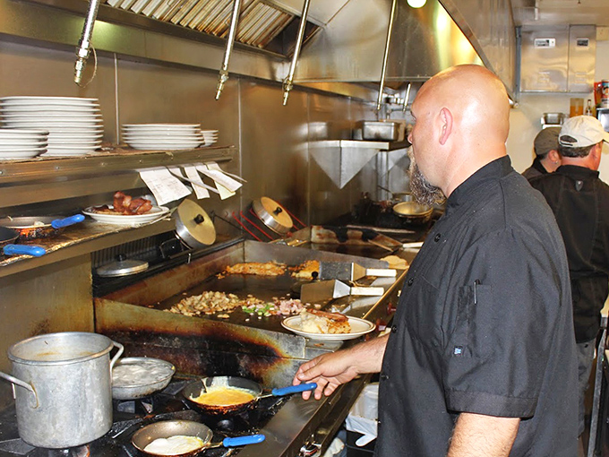 Where breakfast magic happens. The bustling kitchen reveals the choreography behind those perfect eggs and crispy hash browns that keep locals coming back.