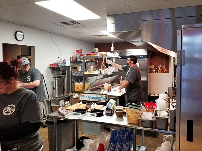 Behind the scenes, the kitchen crew works their smoky magic, turning raw ingredients into barbecue gold.