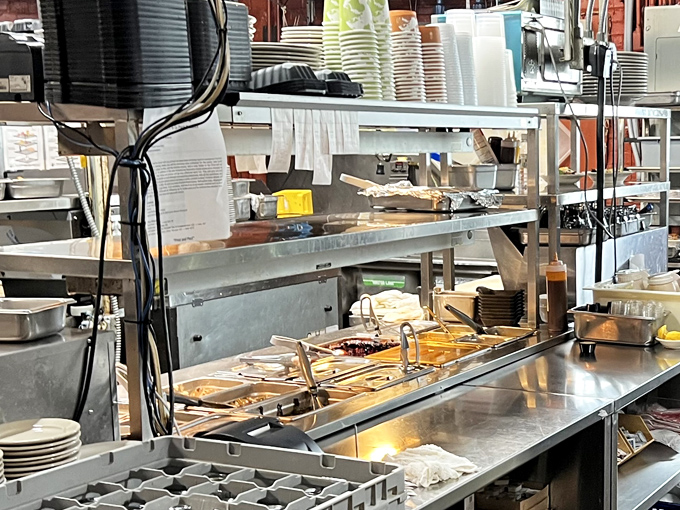 Behind the scenes, the kitchen hums with the organized chaos that produces those plates of Southern magic. Where the real alchemy happens.