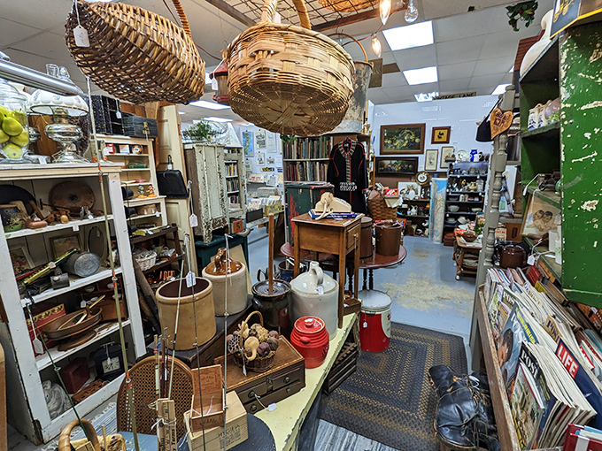 Wicker baskets hanging from the ceiling like suspended time capsules. Below, the organized chaos of collectibles creates a treasure hunter's paradise.