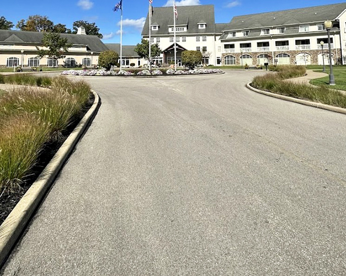 The Lodge entrance curves with purpose, like the opening paragraph of a great novel, promising adventures within its stately walls.