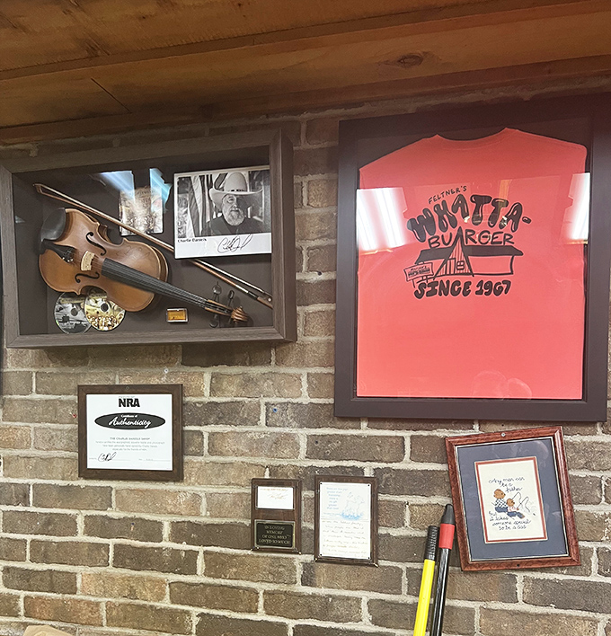 More than decoration, these walls chronicle a burger institution. That framed red t-shirt has witnessed more delicious moments than most food critics.