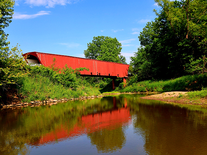 The bridge's reflection in Middle River creates a perfect mirror image&mdash;twice the beauty, twice the history, twice the wonder.