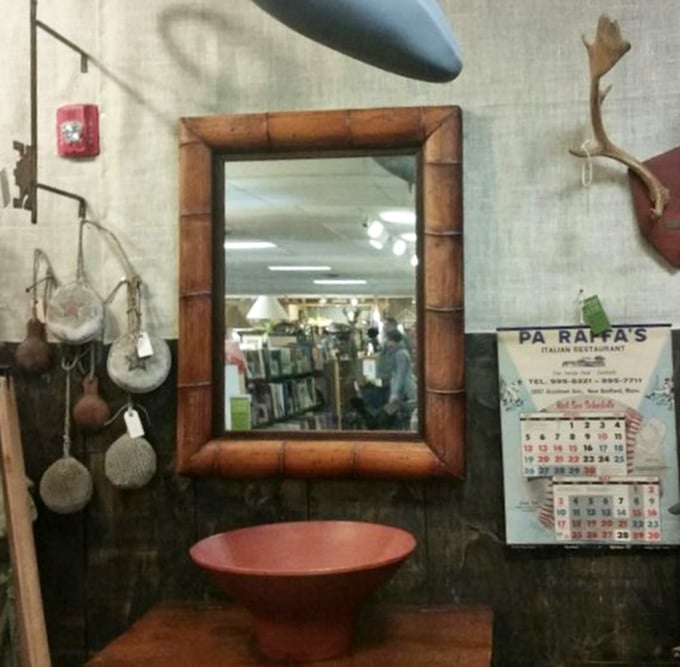 This bamboo-framed mirror doesn't just reflect your face; it frames a glimpse into another era's idea of home d&eacute;cor elegance.