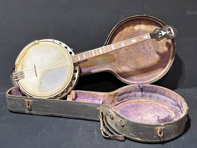 Not just a banjo, but a time machine to front porch jam sessions and bluegrass festivals, complete with its original purple-lined case.