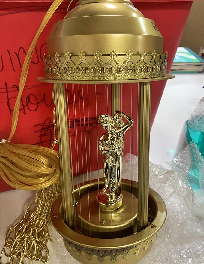 This golden oil rain lamp with its classical figure isn't just vintage decor&mdash;it's conversation-starting kitsch elevated to art form.