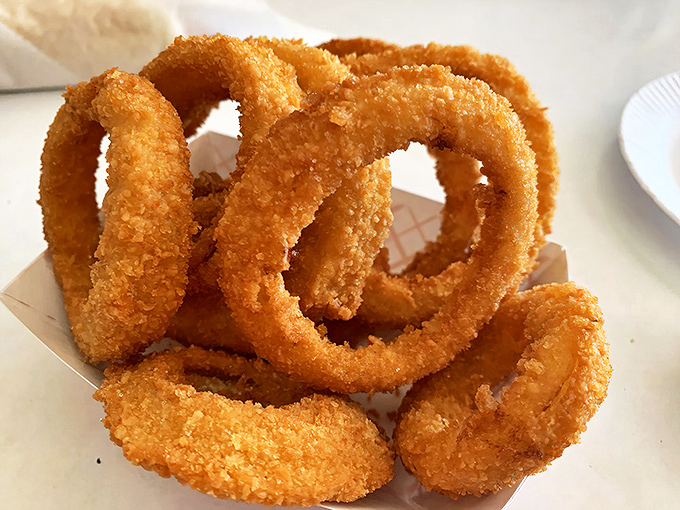 Golden, crispy onion rings that shatter with each bite&mdash;the supporting actor that sometimes steals the show from the main attraction.