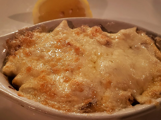 French onion soup with that glorious cheese blanket that stretches like it's auditioning for a commercial.