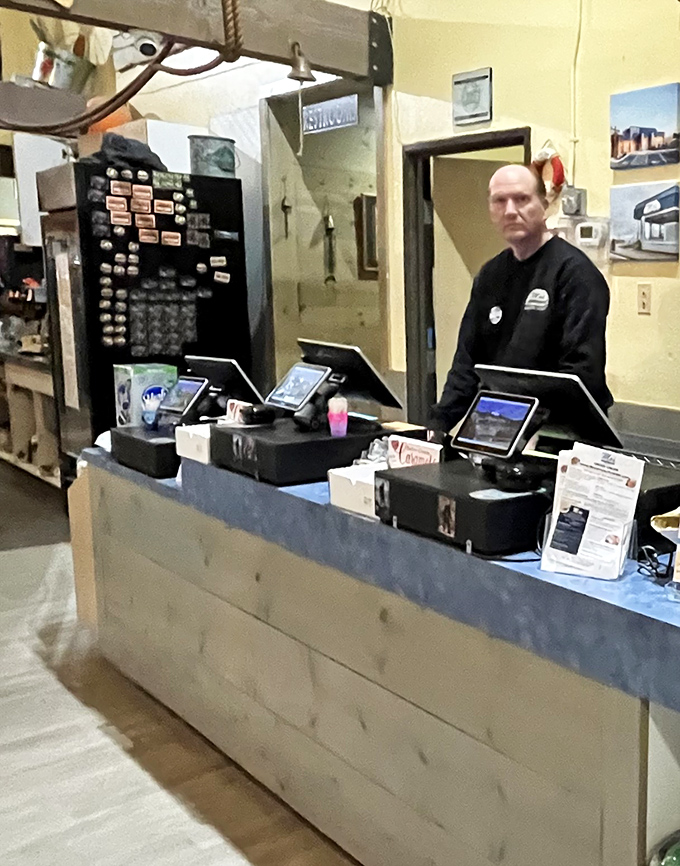 Simple wooden tables and nautical touches create that perfect "you're definitely at the coast" atmosphere that no upscale restaurant could replicate.