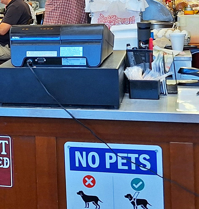 No fancy digital systems here&mdash;just the reassuring simplicity of a traditional cash register and the promise of good food ahead.