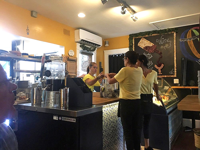 The staff moves with the choreographed precision of people who genuinely love what they do. Yellow shirts add to the sunny, welcoming atmosphere. 