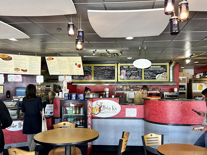 The counter where dreams come true, or at least where bagels transform from mere bread to handheld masterpieces.