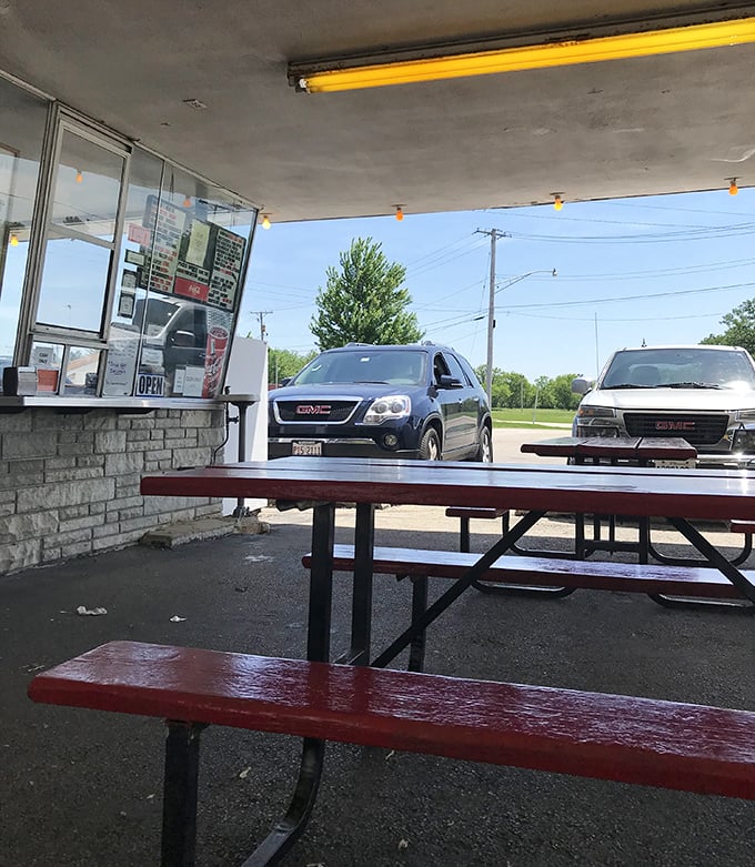 Outdoor seating that says, "We're not fancy, but neither is a picnic, and everyone loves those." Simple tables where countless summer memories have formed.