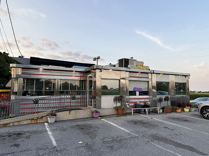 Twilight transforms this humble diner into a beacon of hope for hungry travelers. Like a chrome-plated lighthouse guiding you to breakfast harbor.