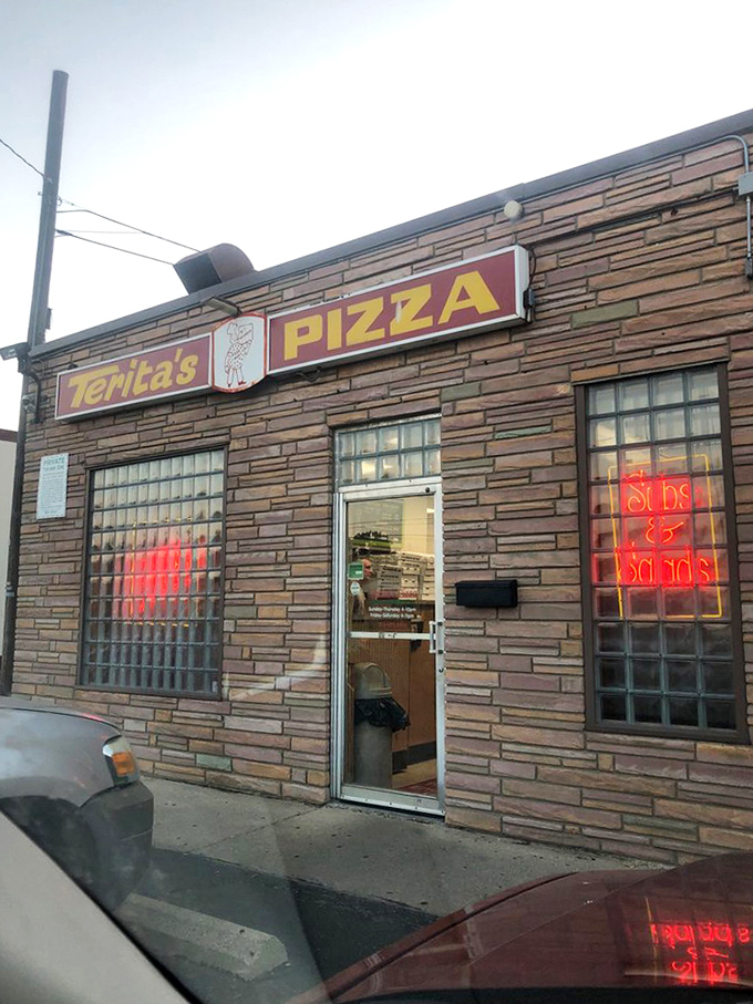 From the parking lot, it looks like any neighborhood joint. Inside, it's pizza paradise that locals have treasured for generations.