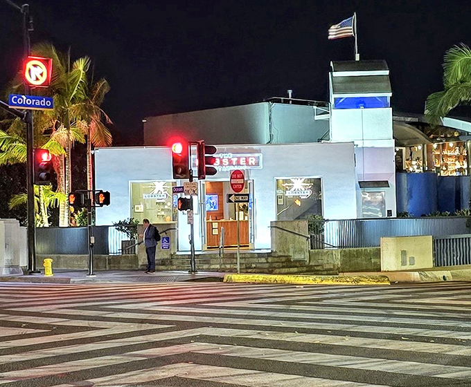 As night falls, The Lobster's illuminated exterior becomes a lighthouse for hungry souls navigating the Santa Monica coastline.