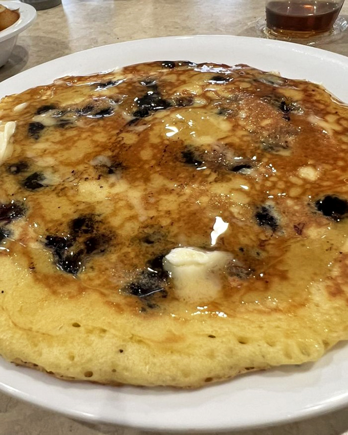 This blueberry pancake isn't just breakfast&mdash;it's a butter-soaked canvas of morning joy that makes you forget all about that "balanced breakfast" nonsense.
