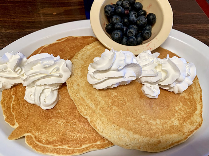 These pancakes aren't just breakfast&mdash;they're dessert with an alibi, topped with enough whipped cream to make your coffee jealous.