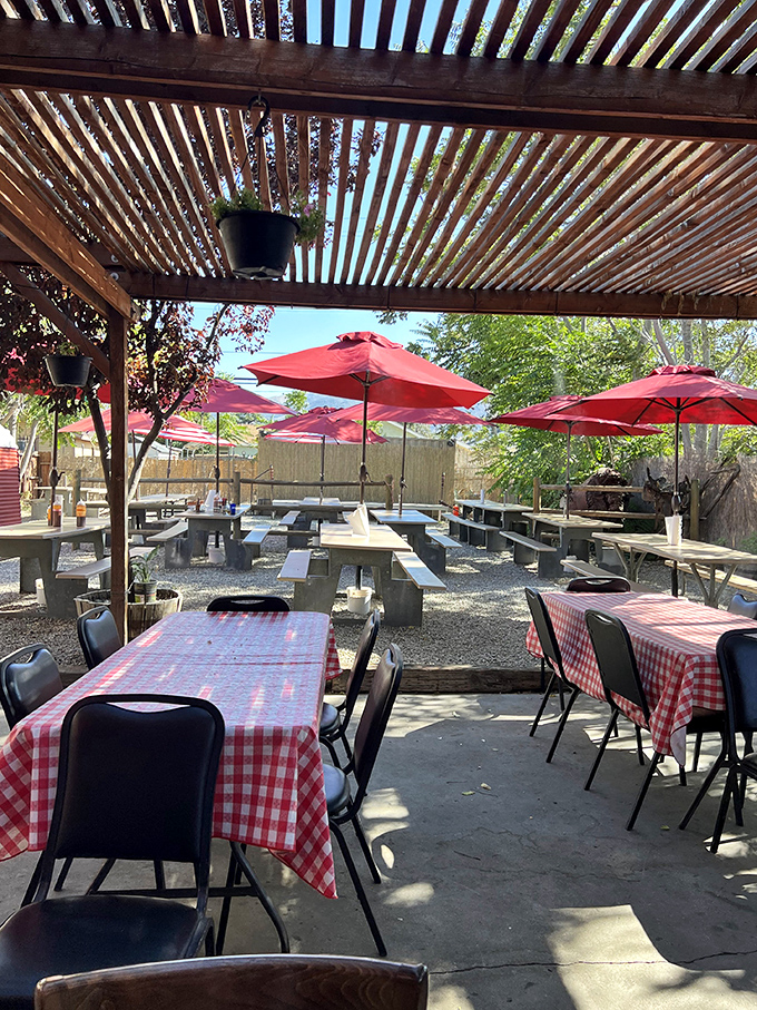 The outdoor patio offers red-checkered tables under a rustic pergola&mdash;because sometimes great barbecue deserves fresh air and sunshine.