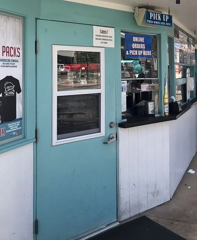 The blue pick-up window: where dreams come true and tacos begin their journey to your eagerly waiting hands.