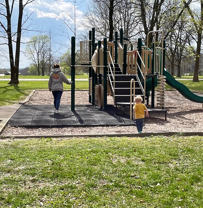 Family memories in the making at the playground, where kids can burn energy before parents introduce them to the wonders of ancient trees.