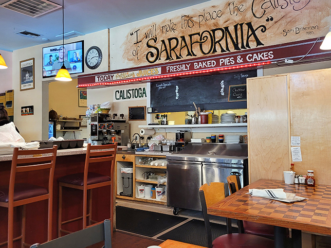 Behind the scenes magic happens here, where the "FRESHLY BAKED PIES & CAKES" sign promises sweet endings to savory breakfast beginnings.