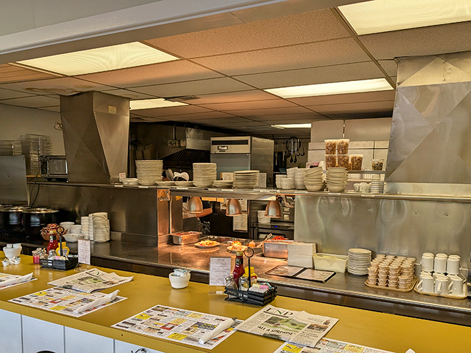 The spotless production area showcases stacks of plates ready for action, evidence of their commitment to feeding crowds.