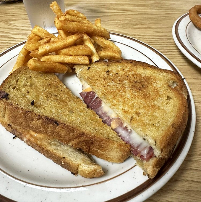 This Reuben doesn't need a fancy introduction&mdash;it speaks for itself. Perfectly grilled bread, generous filling, and fries that deserve their own fan club.