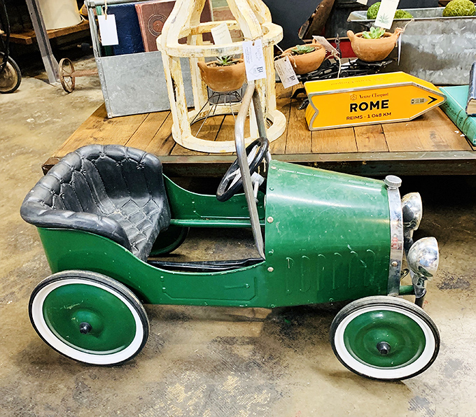 The vintage pedal car that's seen more backyard adventures than a neighborhood full of kids. Green with envy-inducing charm.