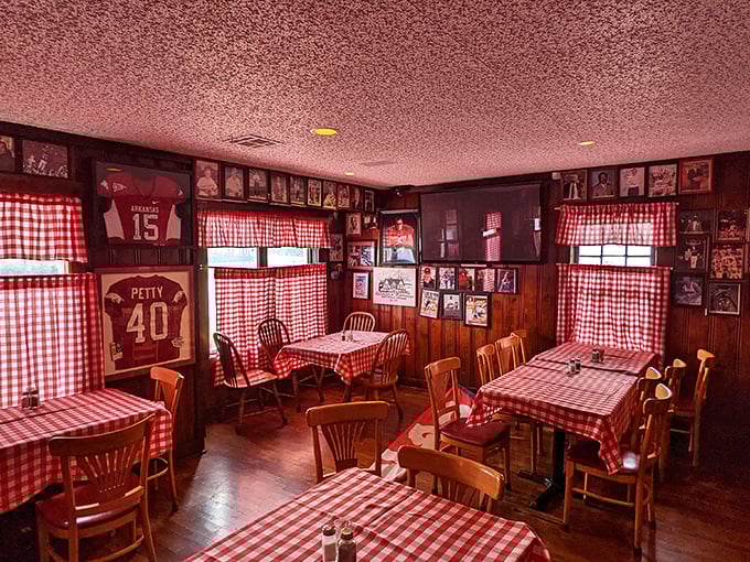 Razorback memorabilia and checkered curtains create a dining room that feels like Sunday dinner at your favorite aunt's house&mdash;if she were a steak genius.