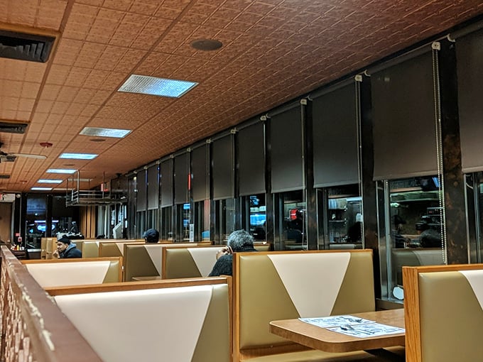 Vinyl booths await their next occupants, while the pressed tin ceiling and warm lighting create the perfect backdrop for making memories over meatloaf.