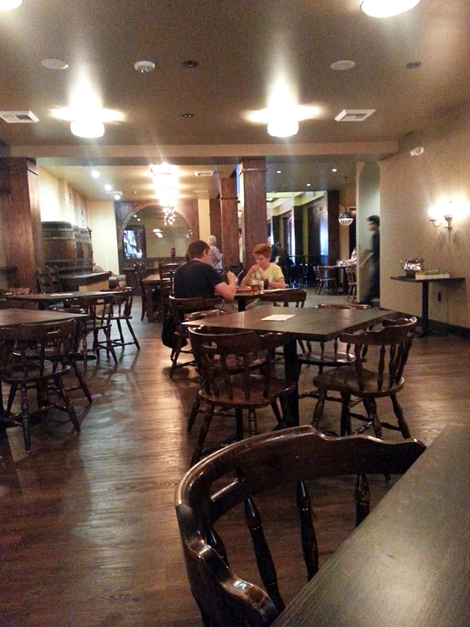 The dining area invites lingering conversations that turn strangers into friends over shared plates and pint glasses.