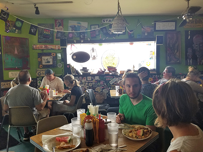The green walls have seen it all. In this cozy space, every table hosts conversations worth eavesdropping on.