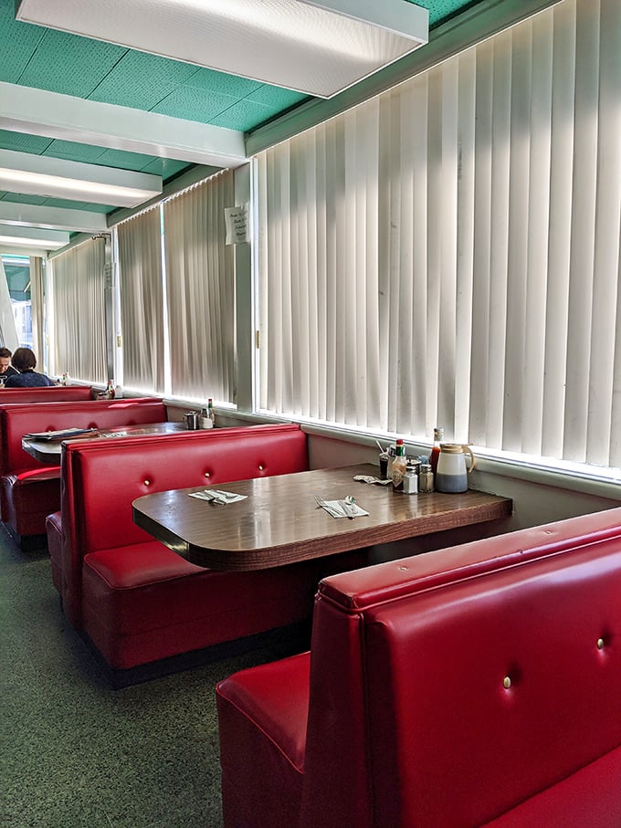 Red vinyl booths that have probably hosted more life conversations than most therapists' offices, significantly cheaper per hour too.
