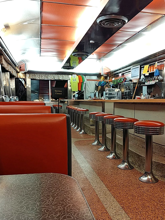 Late night at the diner &ndash; red vinyl booths empty but waiting, counter stools standing at attention for tomorrow's breakfast brigade.