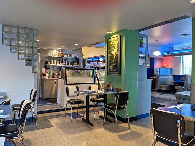 Retro meets modern in this dining space where the color palette says "classic diner" but the vibe whispers "this isn't your grandfather's greasy spoon."