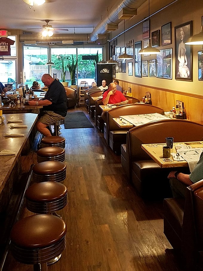 The synchronized ballet of coffee refills and friendly nods happens in this wood-paneled sanctuary where everyone belongs, regardless of social media status.