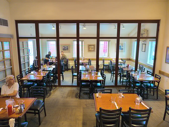 Separate dining areas create the illusion of intimacy in a restaurant where everyone's united by the universal language of "pass the syrup, please."