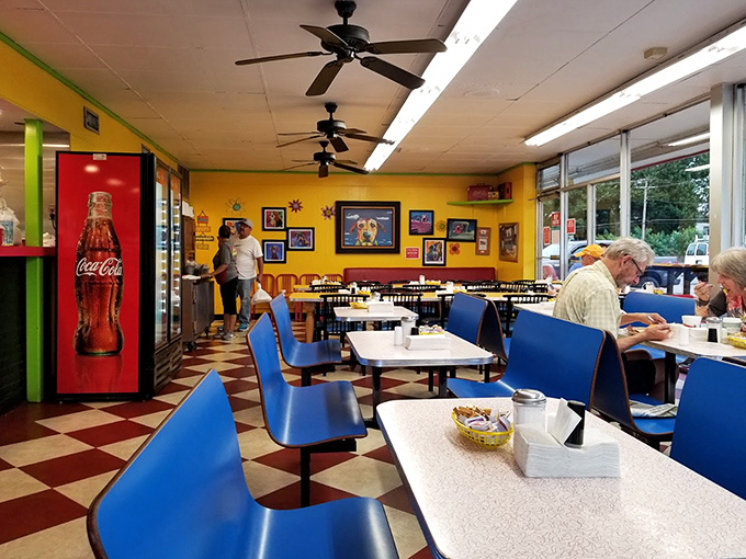 Blue booths and bright yellow walls create a cheerful backdrop for serious eating. Breakfast isn't just a meal here&mdash;it's a movement.