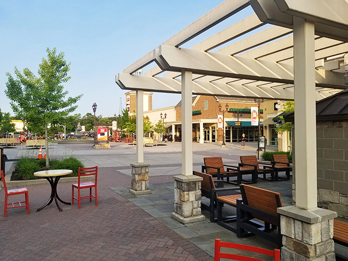 Shaded seating areas strategically placed for bag-staging, phone-checking, and pretending you're definitely done shopping before continuing anyway.