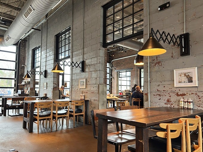 Distressed walls and accordion lamps create an atmosphere that says, "Yes, we're cool, but we're more interested in your happiness than our Instagram potential."