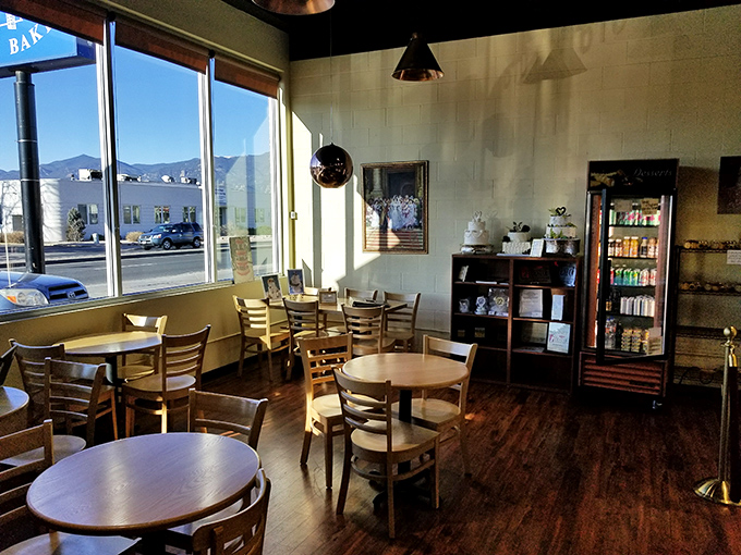 Sunlight streams through windows illuminating simple wooden tables where pastry-fueled conversations and coffee revelations happen daily.