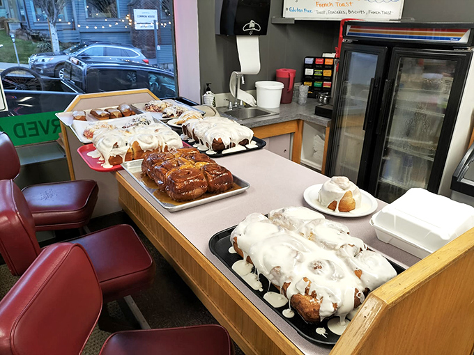 Pastry paradise awaits! Cinnamon rolls and sticky buns lined up like contestants in the world's most delicious beauty pageant.